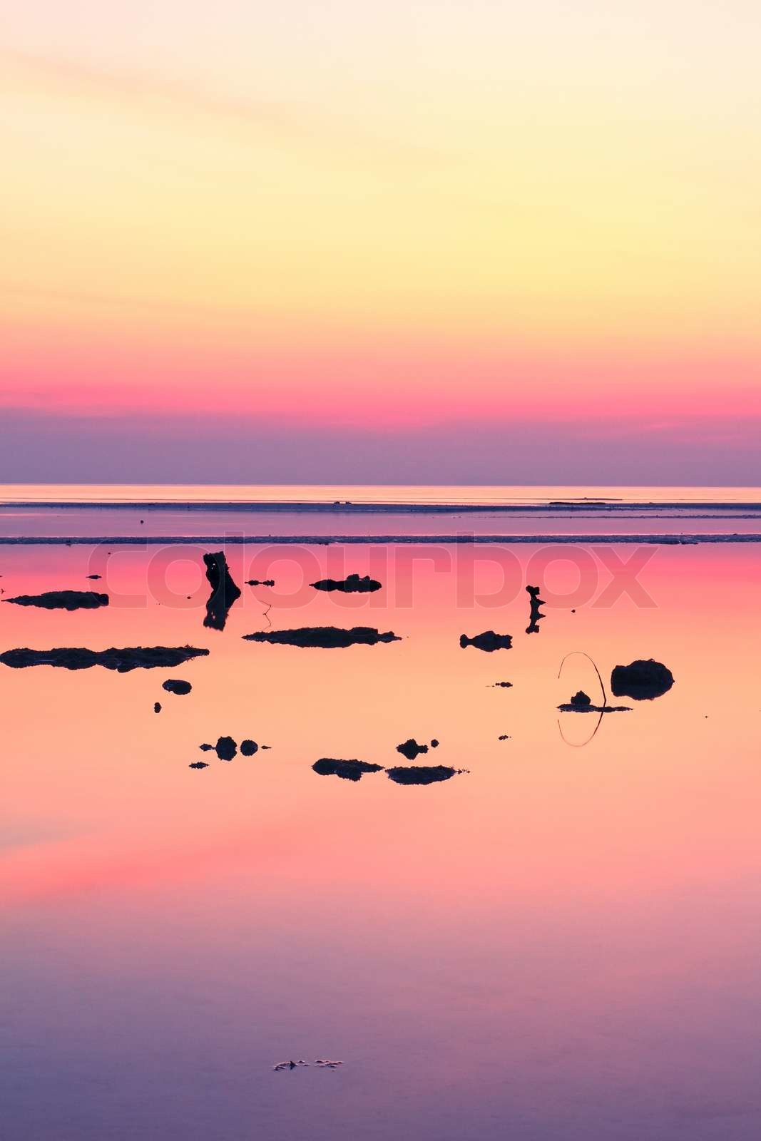 Sunset sky reflection over clear sea | Stock image | Colourbox
