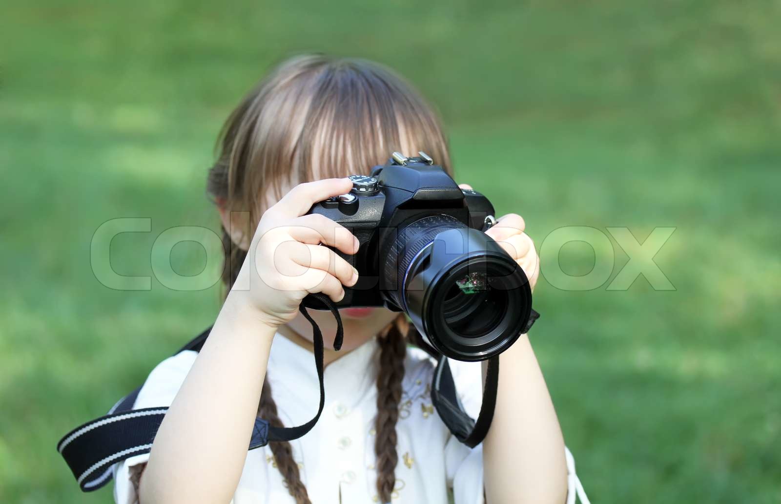 Little Girl Using Camera