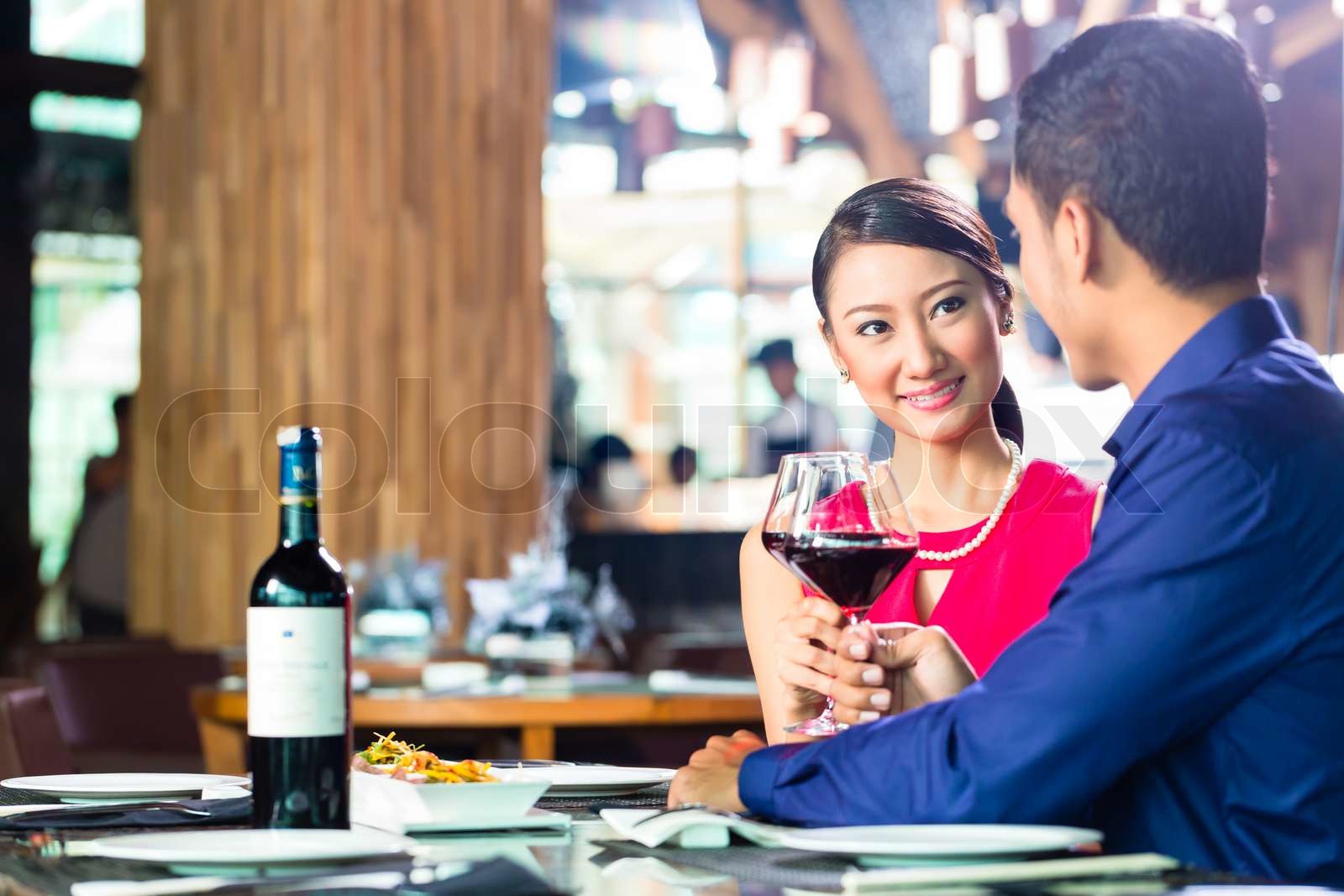 Asian couple fine dining in restaurant | Stock image | Colourbox