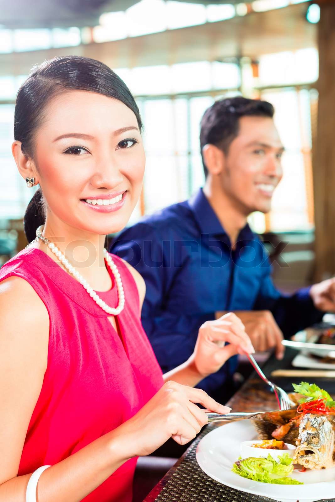 Asian people fine dining in restaurant | Stock image | Colourbox