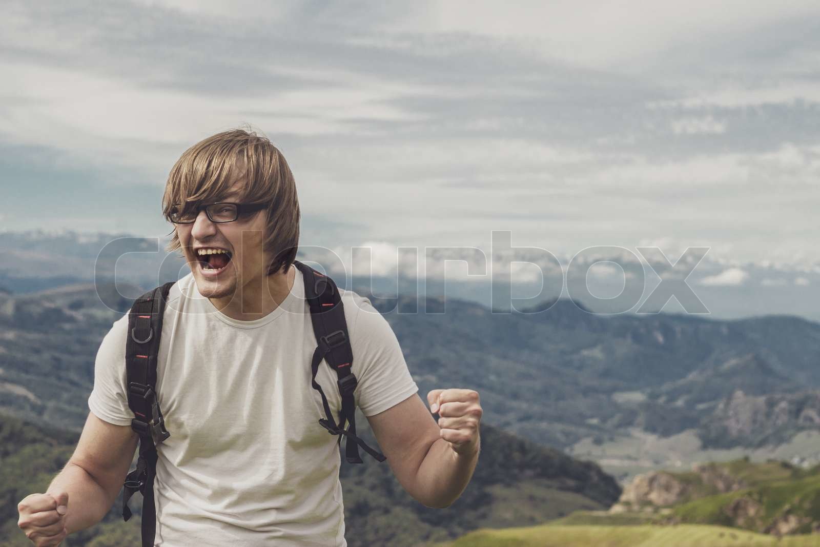 man shouting at the mountain top | Stock image | Colourbox