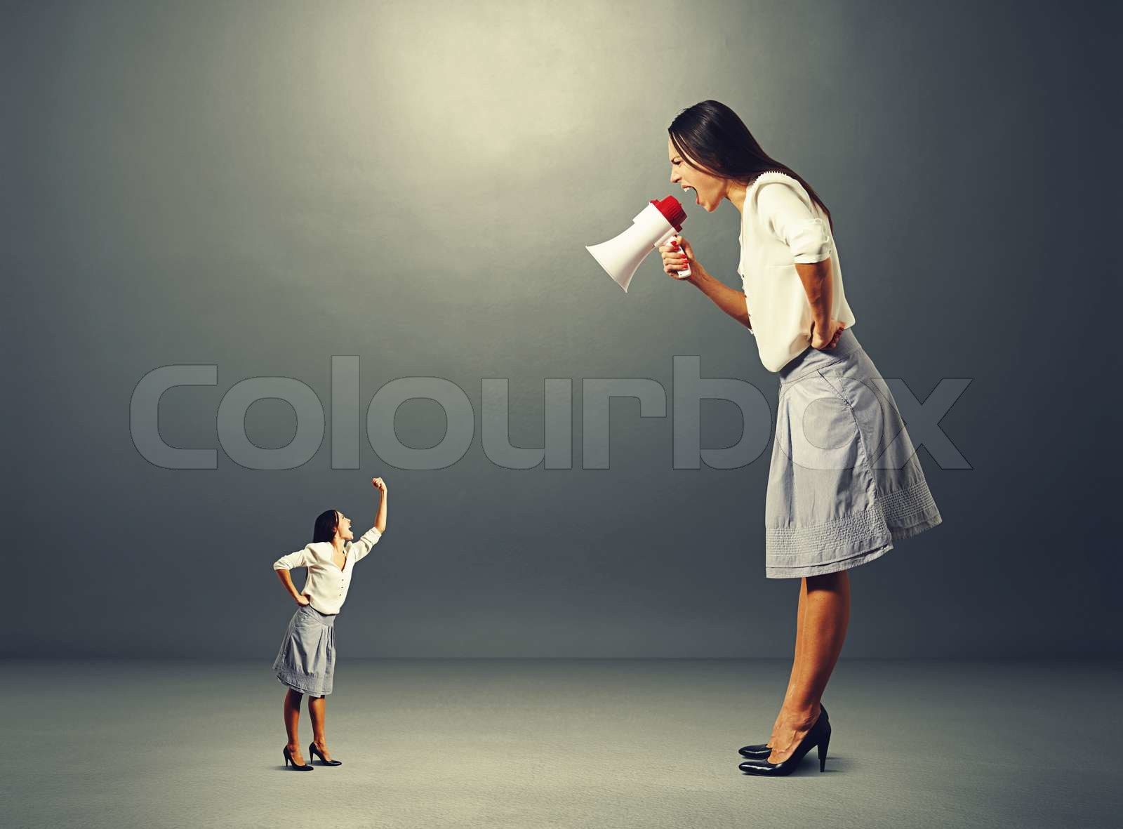 woman screaming at big angry woman | Stock image | Colourbox