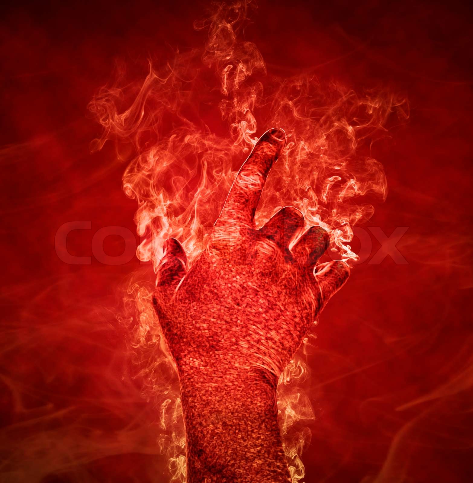 menschliche Hand Waffen Feuer auf rotem Grund | Stock Bild | Colourbox