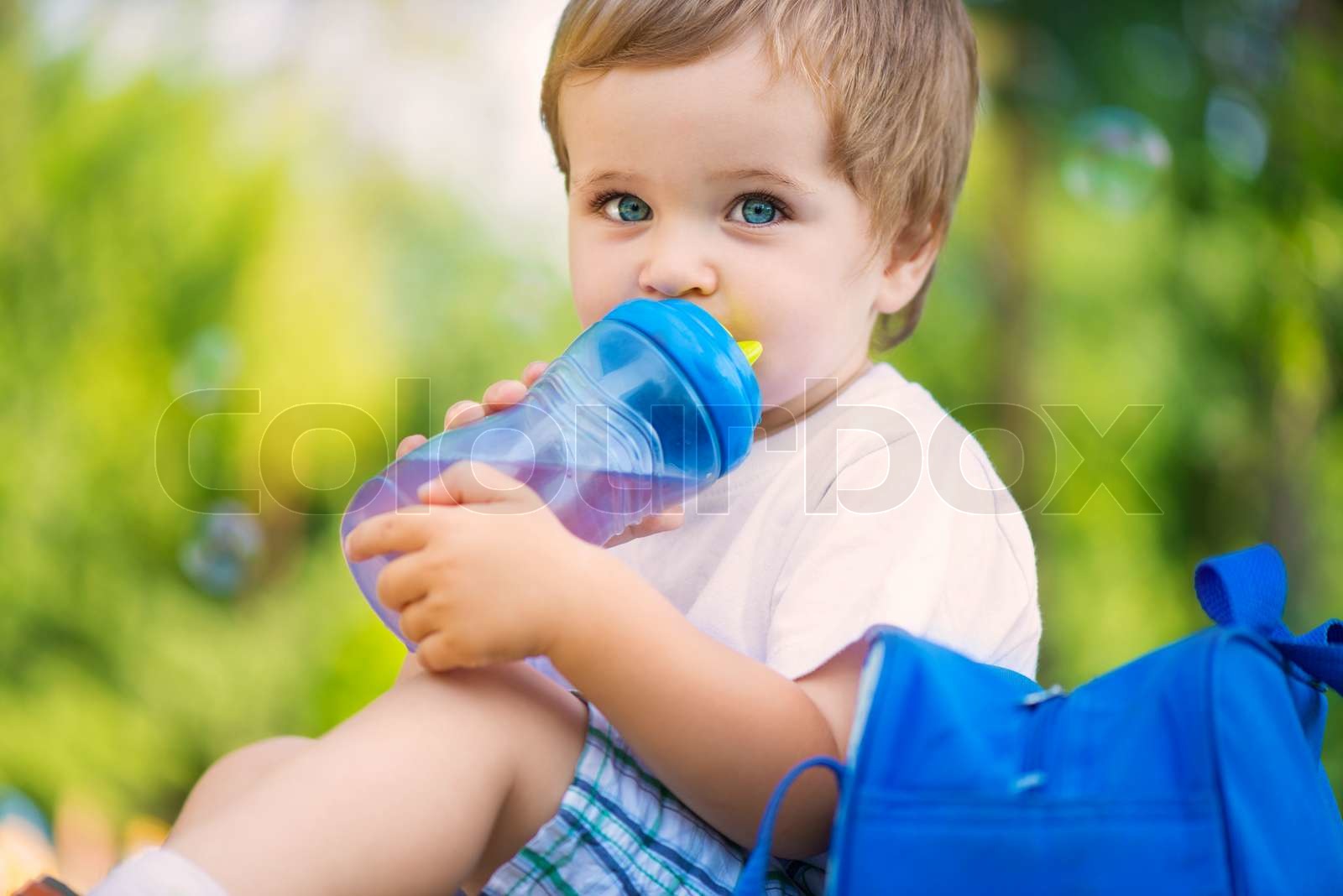 Cute little boy drinking water | Stock image | Colourbox