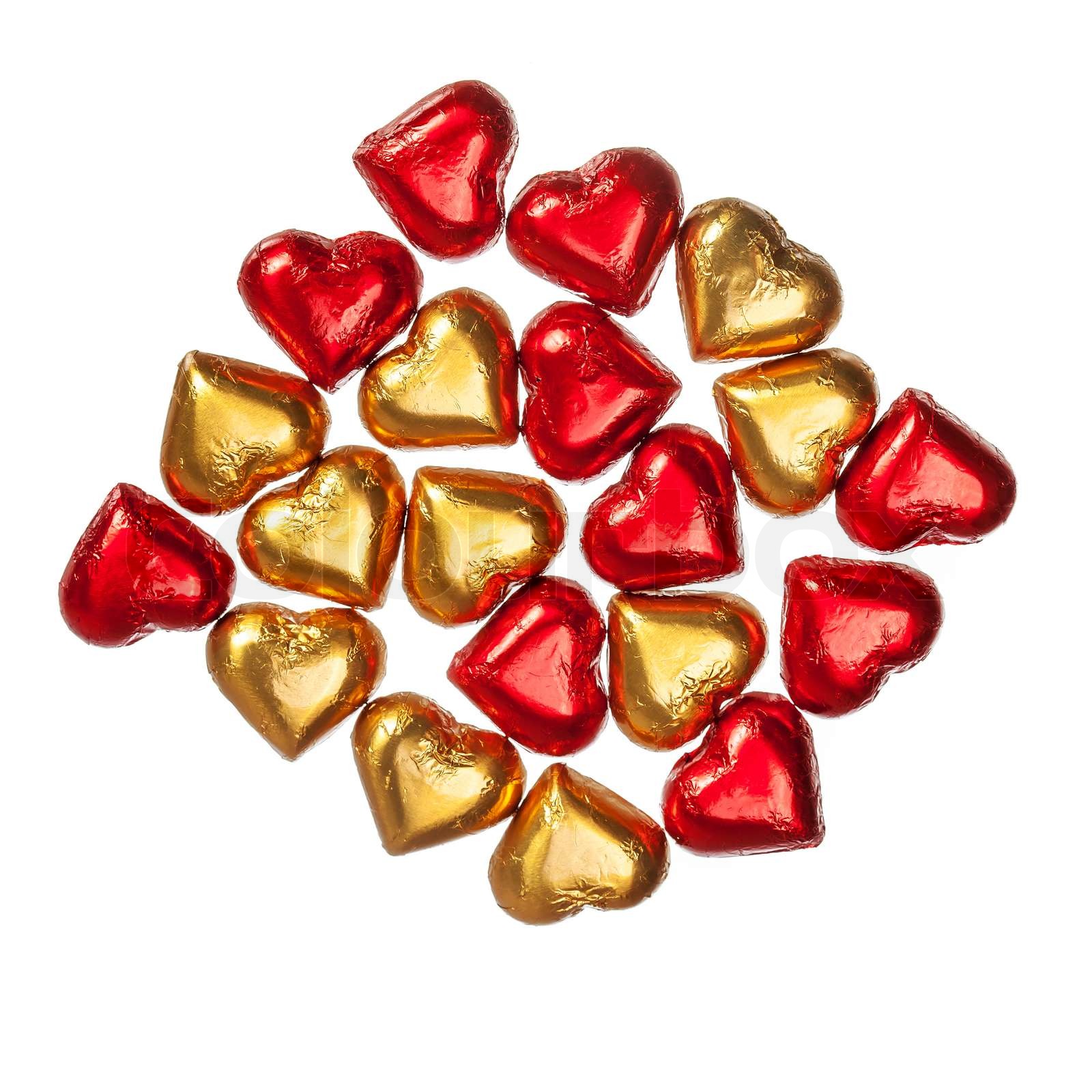 Red and yellow chocolate candies on white | Stock image | Colourbox