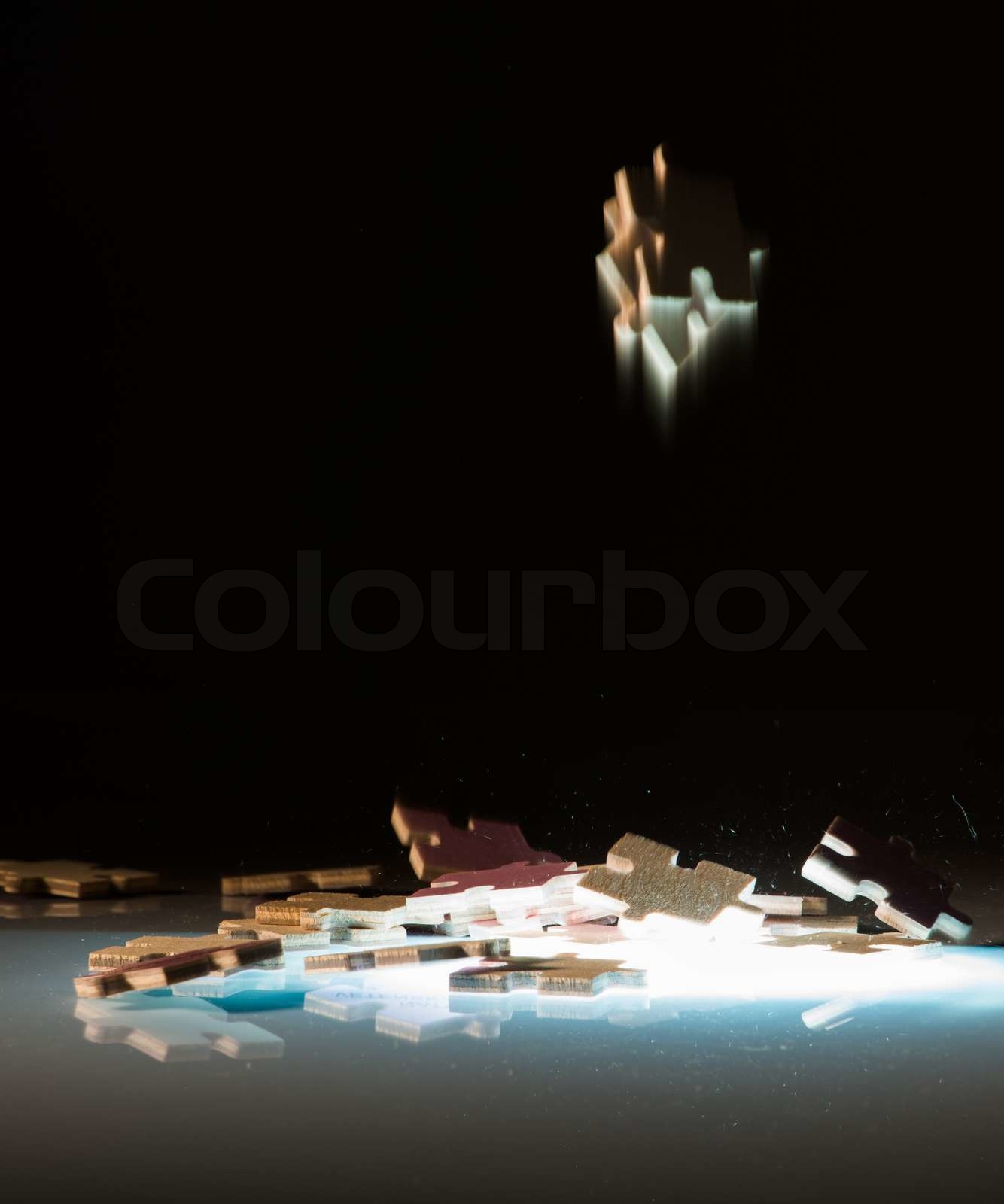 Falling puzzle pieces. | Stock image | Colourbox
