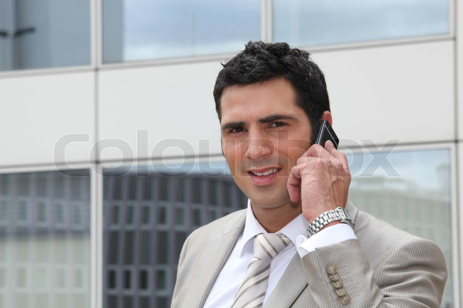 Smart man talking on phone | Stock image | Colourbox