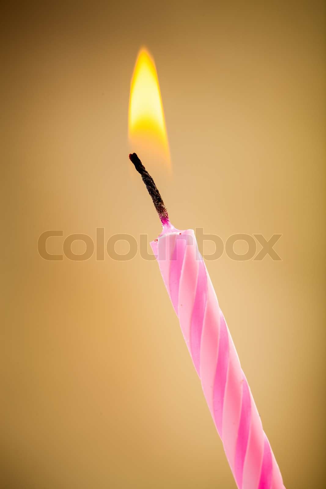 Burning birthday candle | Stock image | Colourbox