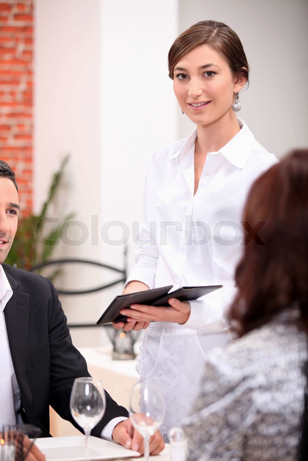 Waitress in a restaurant | Stock image | Colourbox