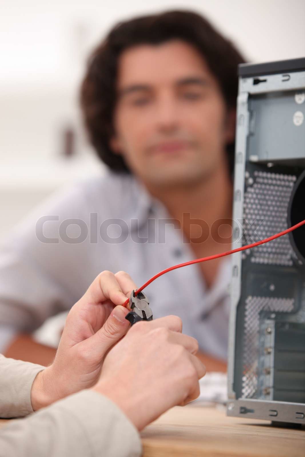 close-up of hands fixing computer | Stock image | Colourbox