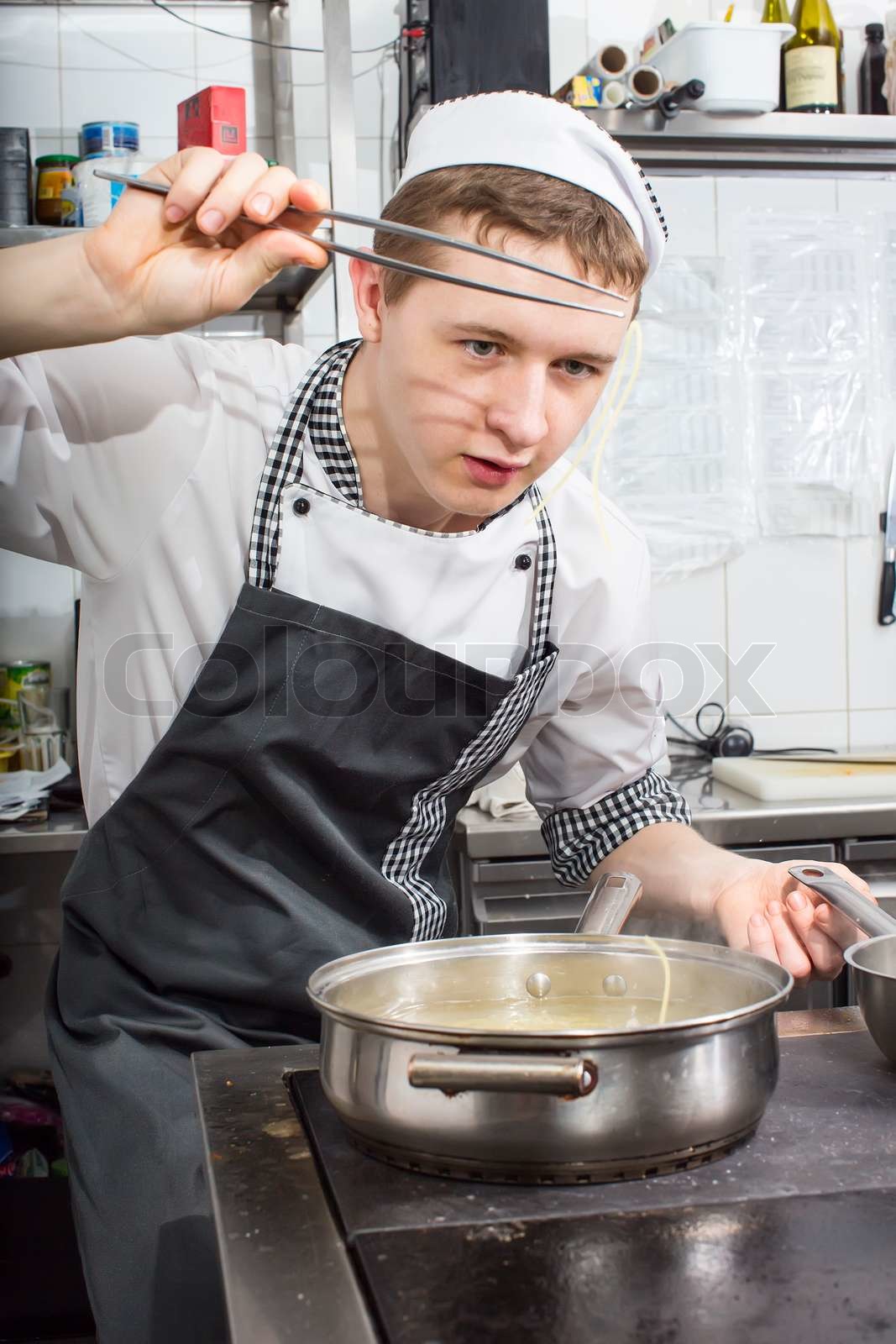 chef preparing food in the kitchen at the restaurant | Stock image ...