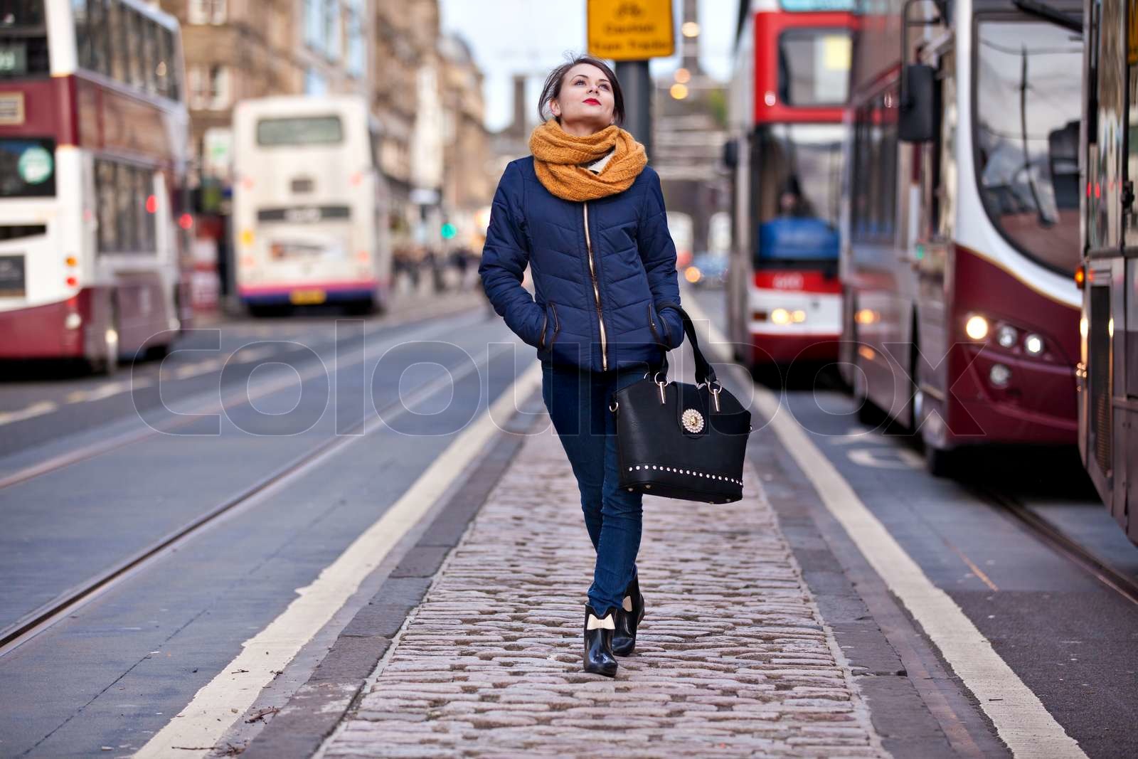 Pretty girl walking on the road | Stock image | Colourbox