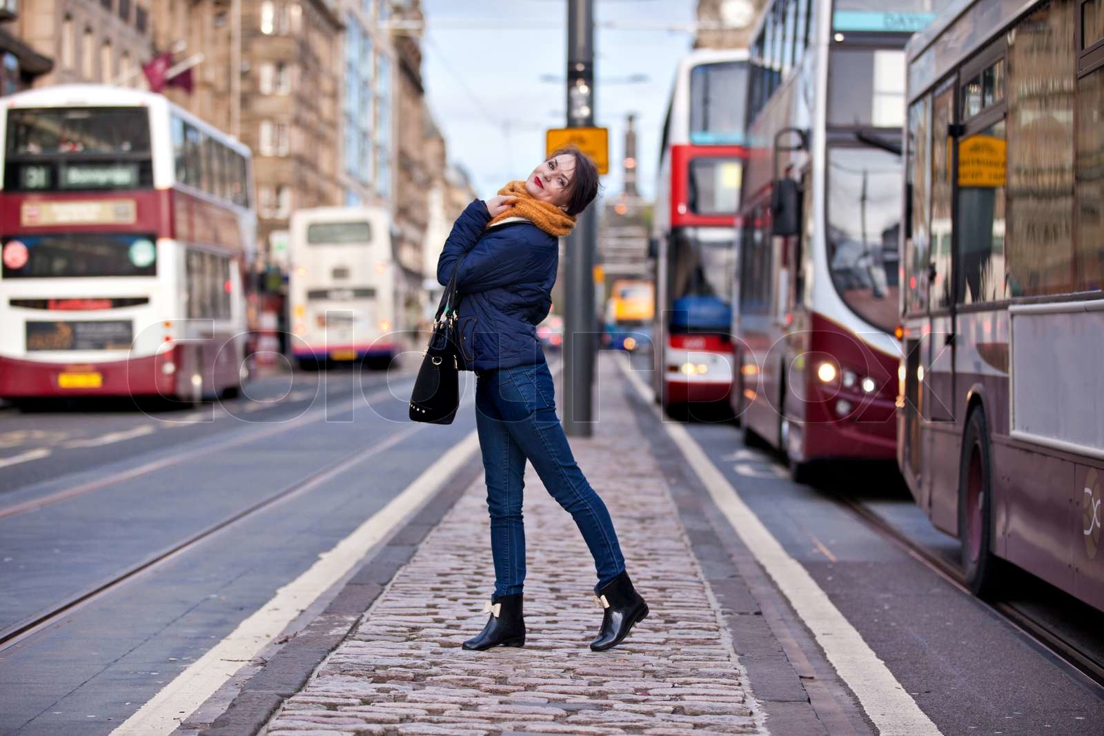 Pretty girl walking on the road | Stock image | Colourbox