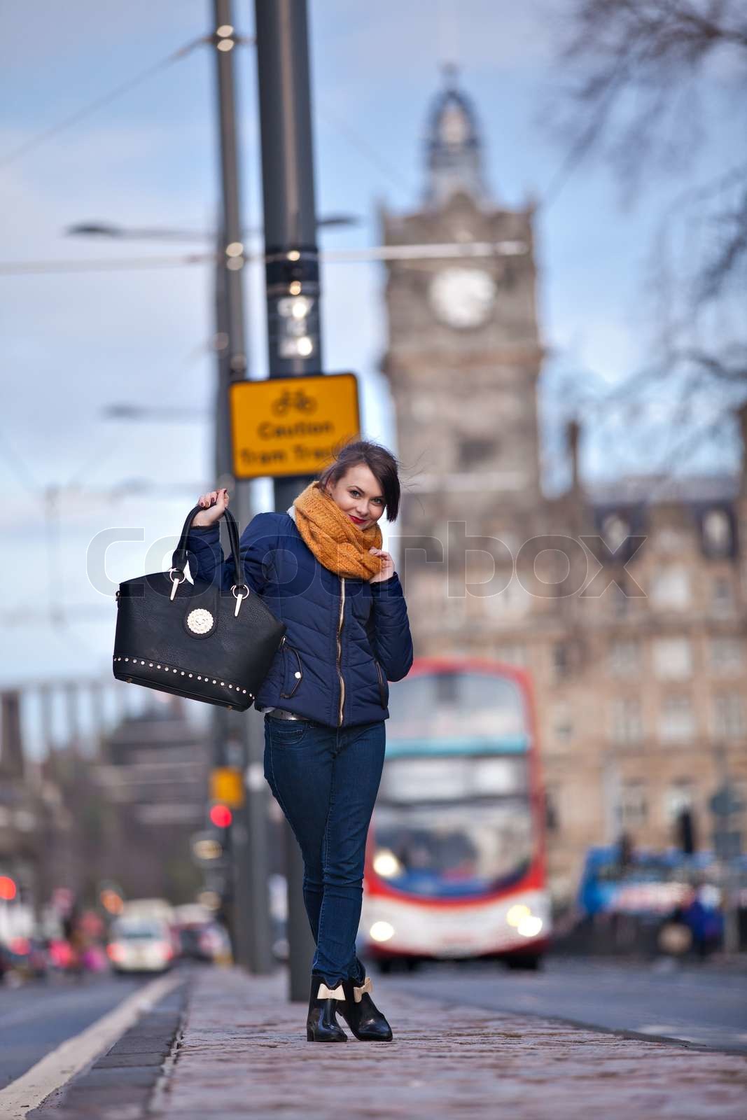 Pretty girl walking on the road | Stock image | Colourbox