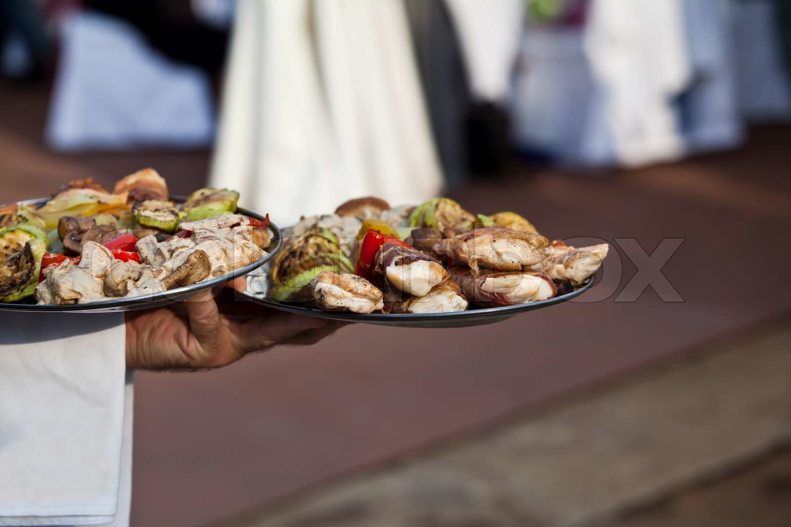 waiter carrying plates of food | Stock image | Colourbox