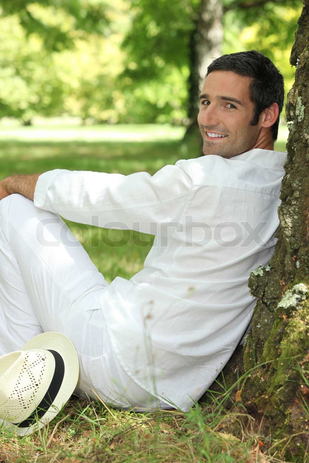 Man resting under tree | Stock image | Colourbox