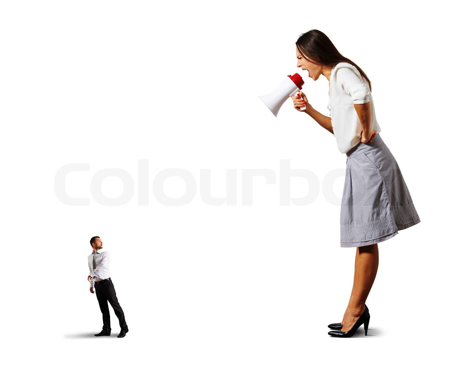 scared man going away from big angry woman | Stock image | Colourbox