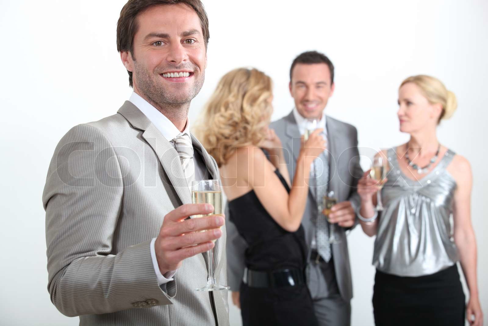 Four smartly dressed people | Stock image | Colourbox