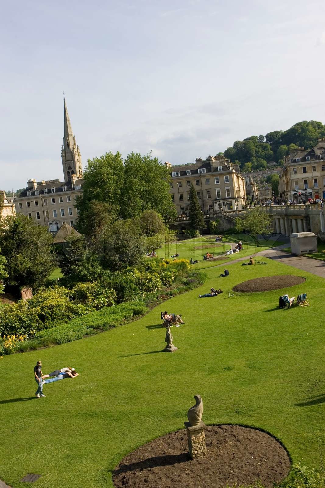 People sunbathing in a british park | Stock image | Colourbox