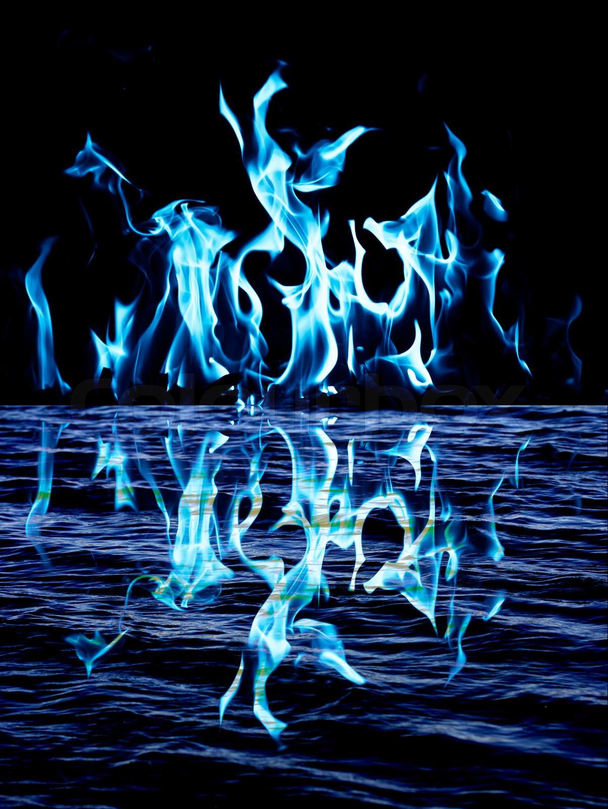 blue flame fire with reflection in water | Stock image | Colourbox