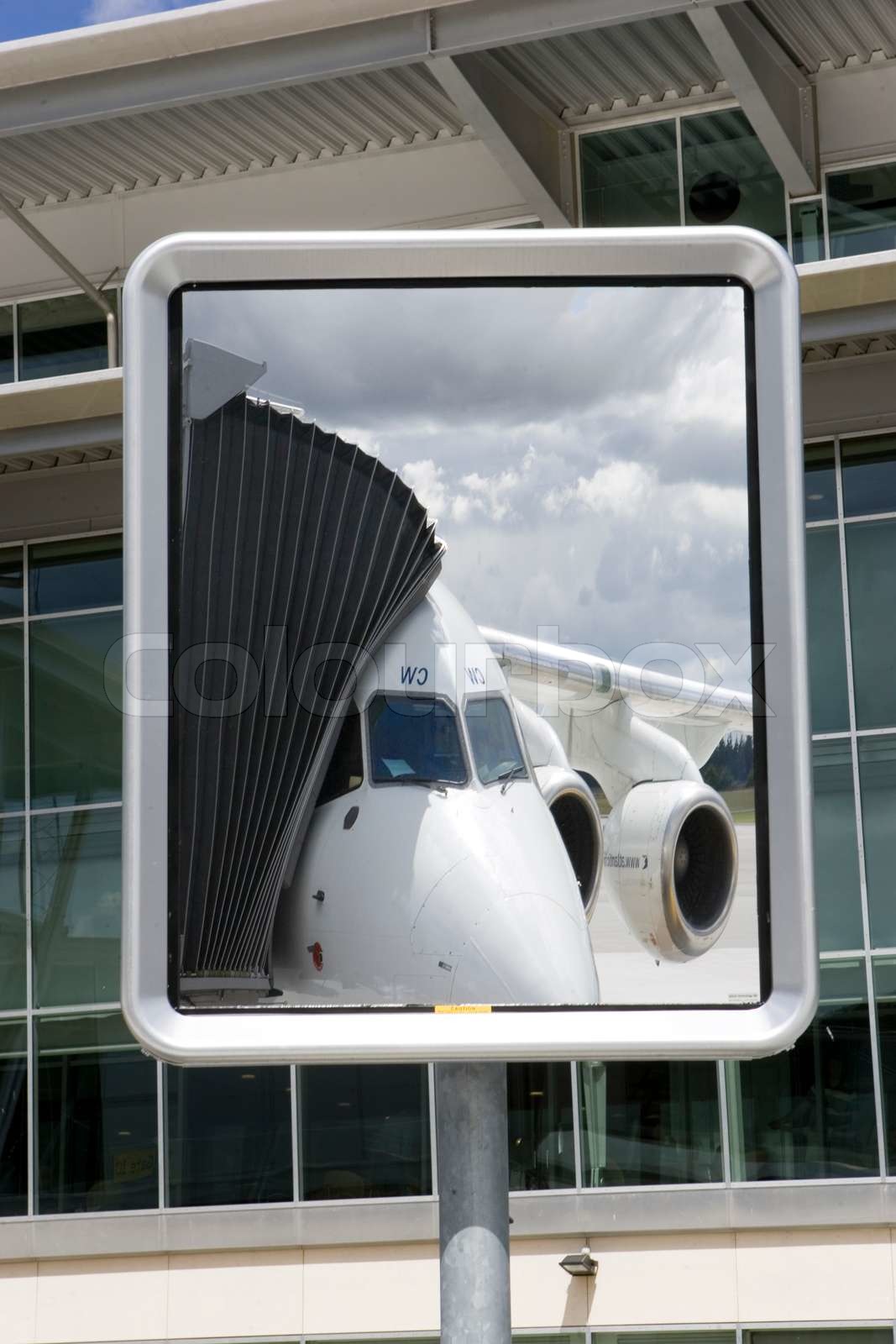 Reflection of an airplane in a mirror | Stock image | Colourbox