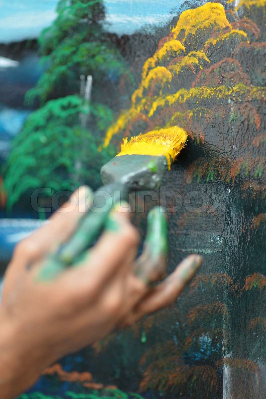 Hand painting wall closeup | Stock image | Colourbox