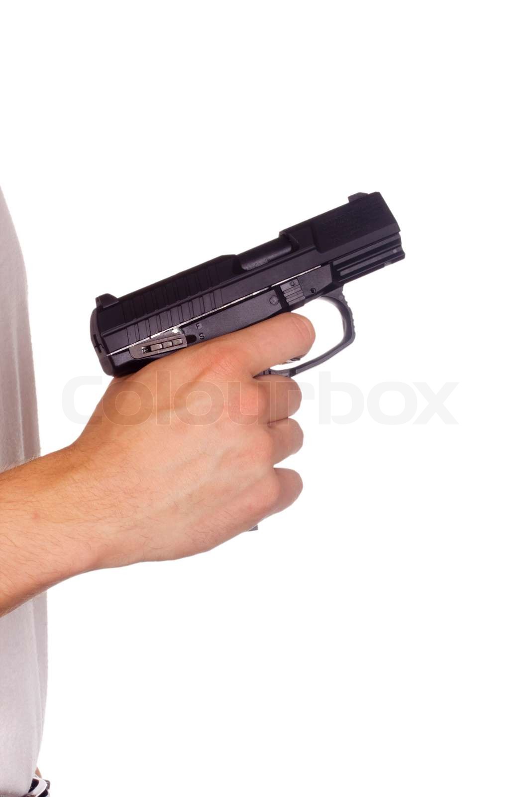 Pistol in hand | Stock image | Colourbox