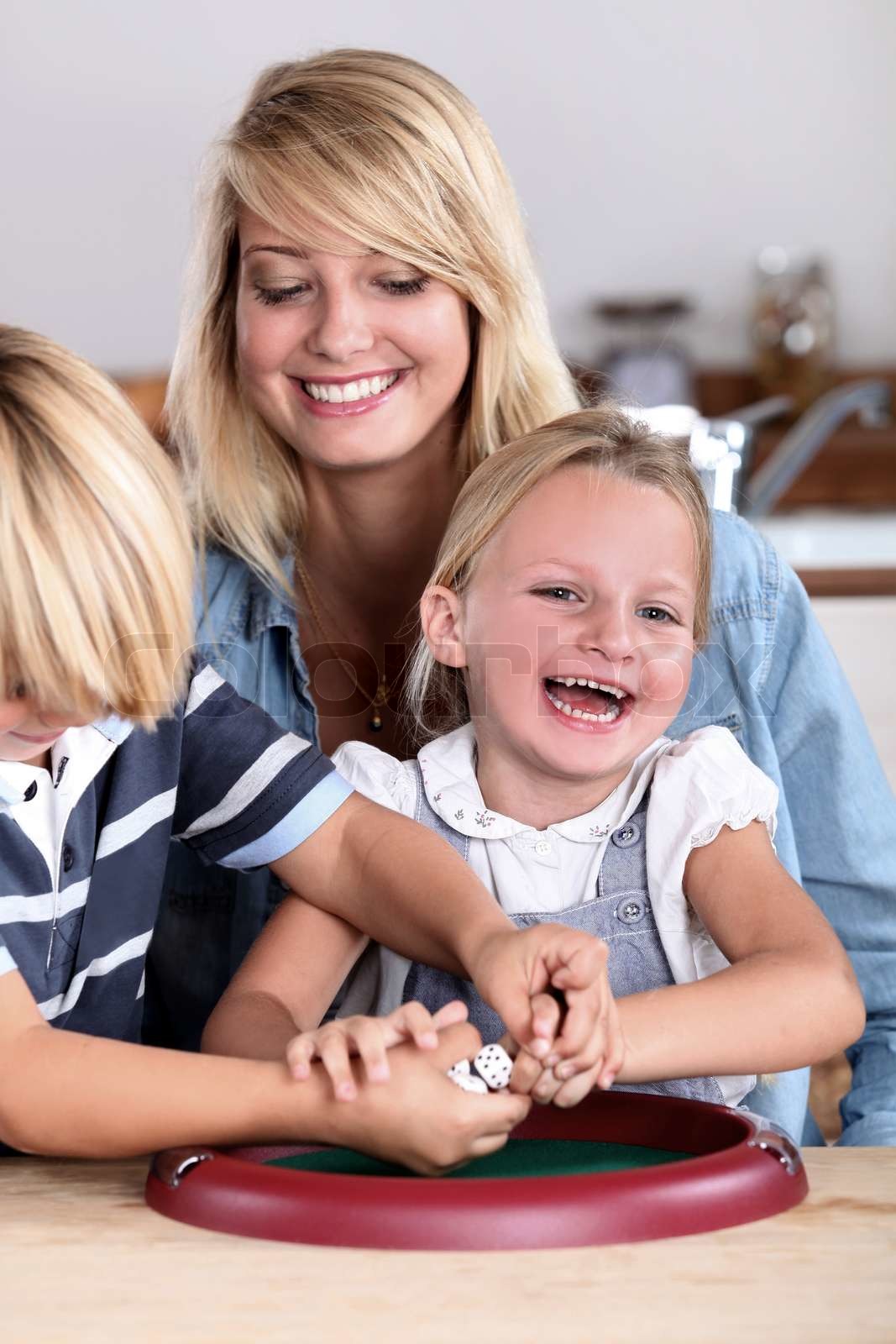 Children playing with dice | Stock image | Colourbox