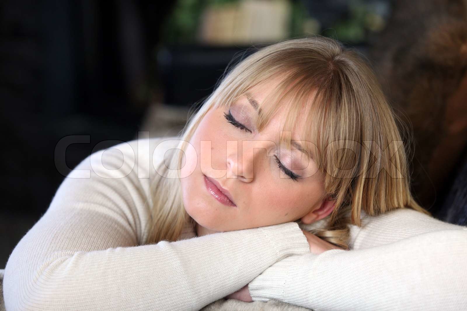 Blond woman snoozing | Stock image | Colourbox