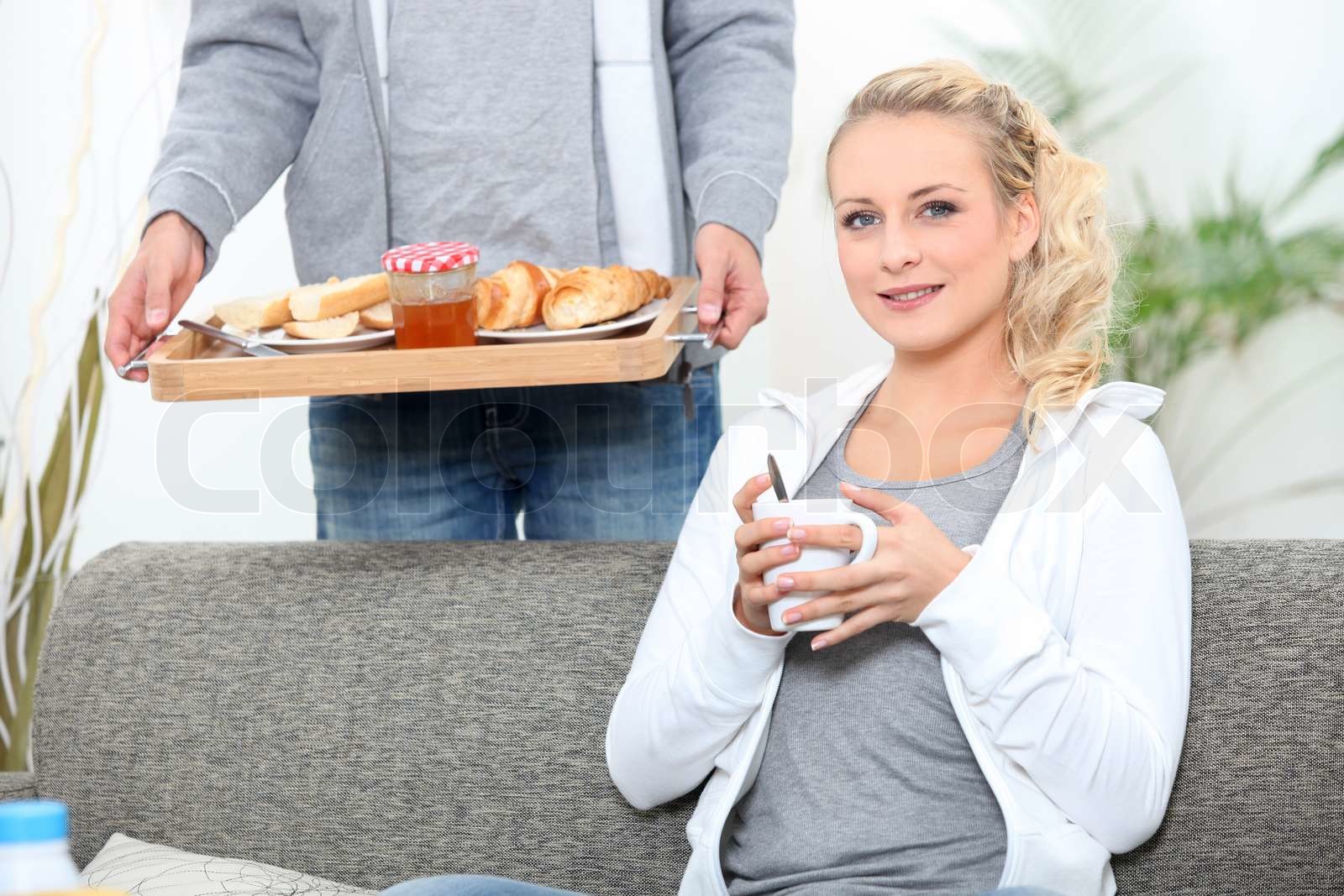 Man serving woman breakfast | Stock image | Colourbox