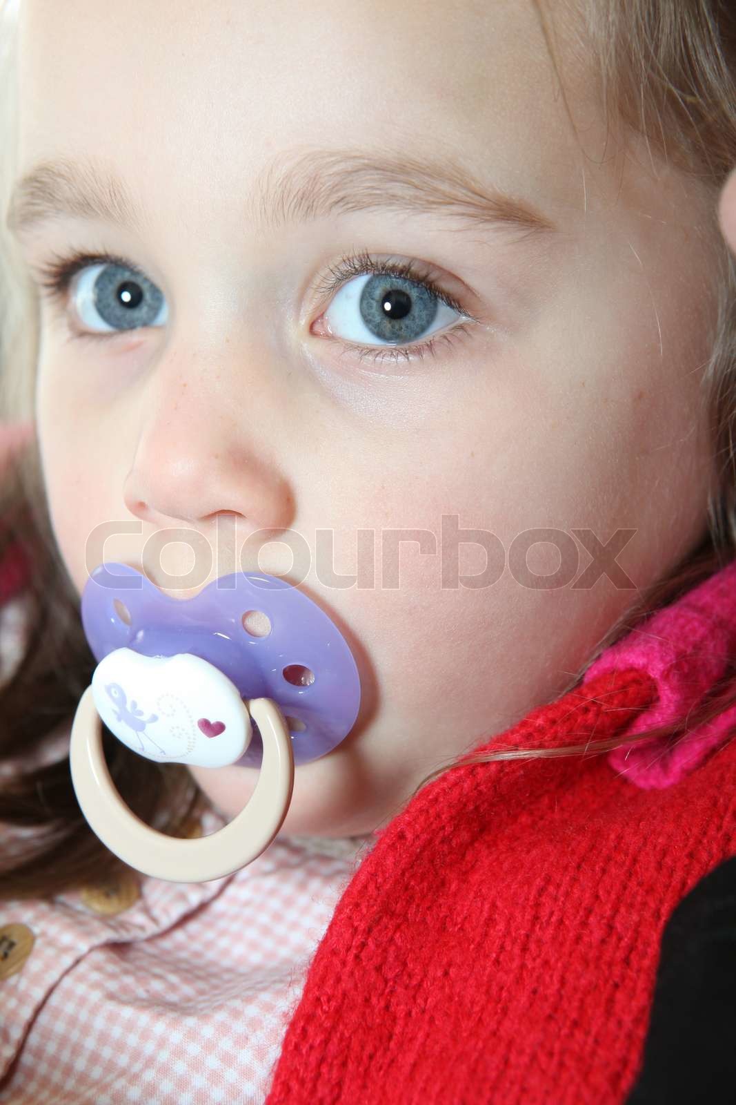 Little girl with dummy | Stock image | Colourbox