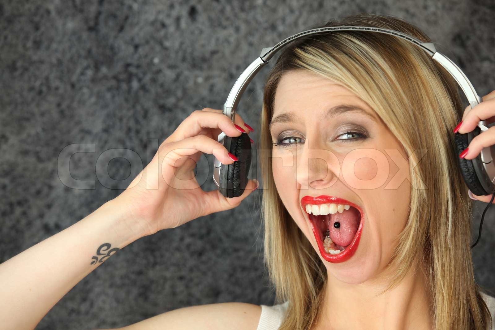 Woman having fun singing loudly | Stock image | Colourbox