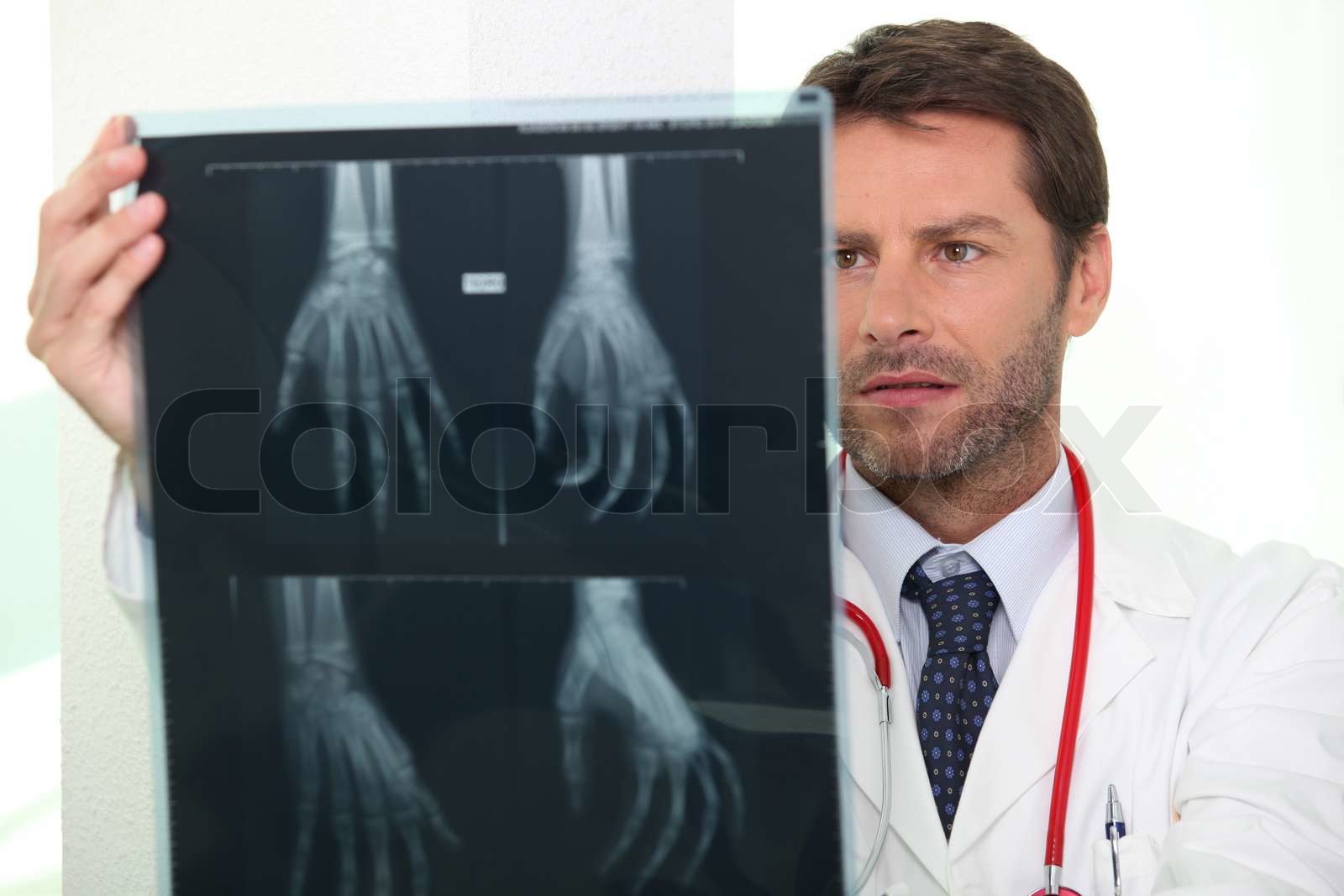 Doctor looking at X-ray | Stock image | Colourbox