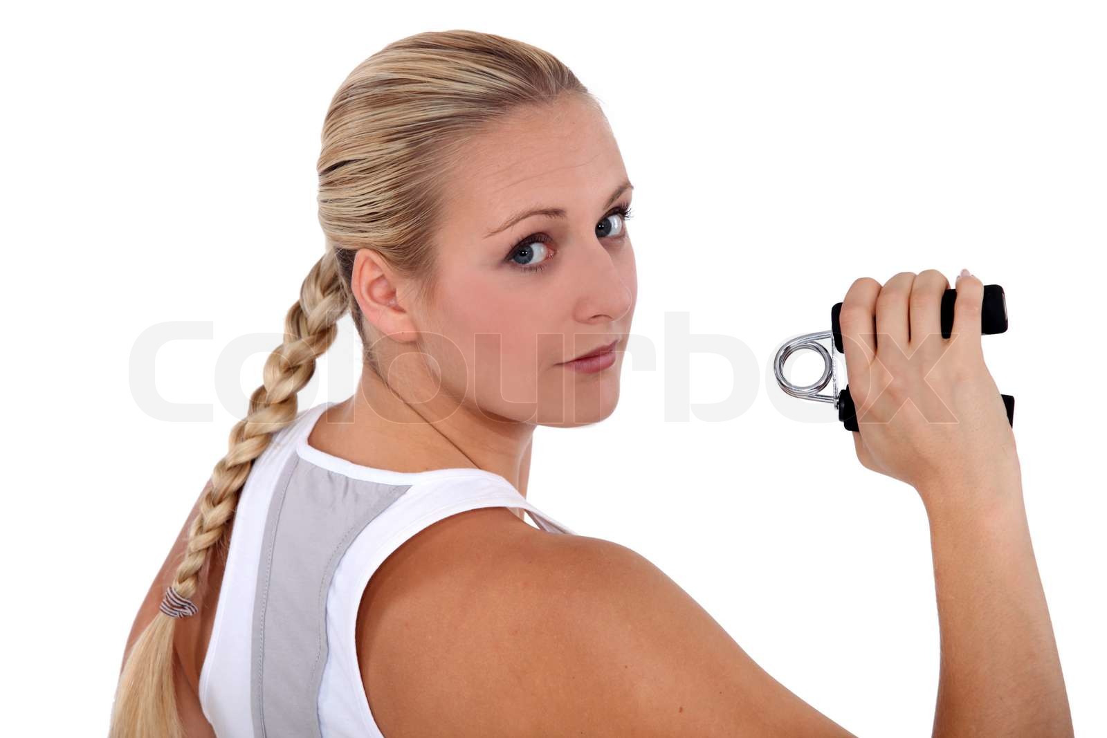 fit woman holding a gripper | Stock image | Colourbox