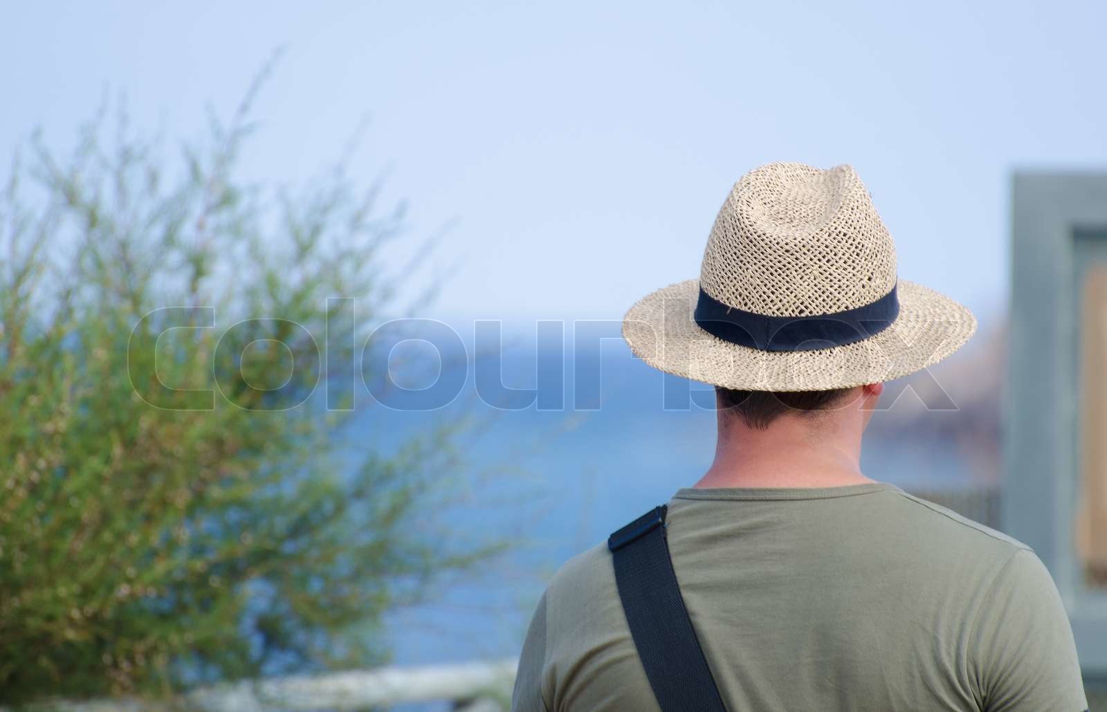 Man in a wicker hat. Back view. | Stock image | Colourbox