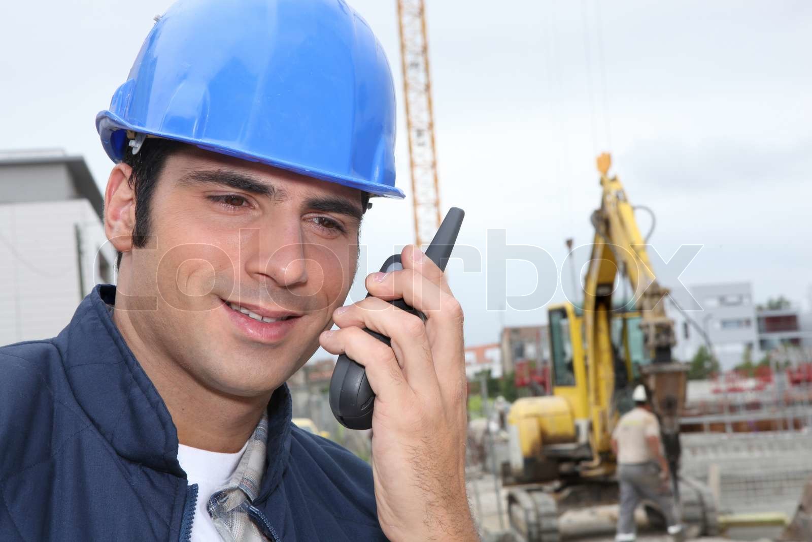 Foreman communicating via radio | Stock image | Colourbox