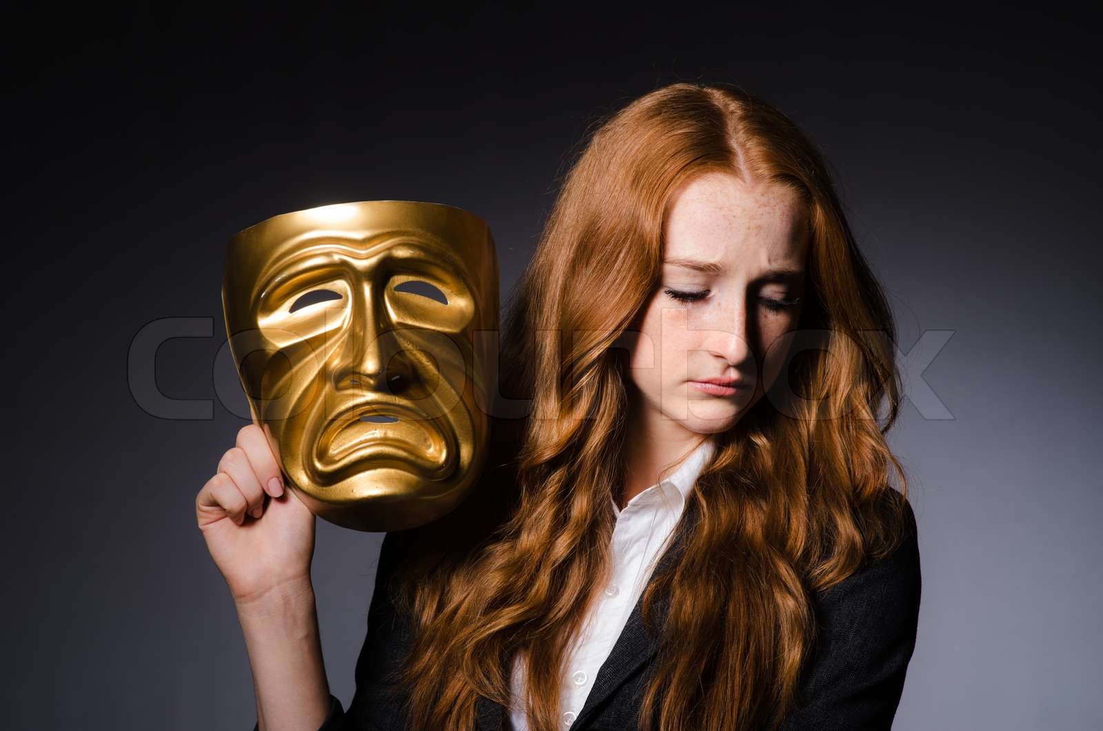 Woman with mask in hypocrisy concept | Stock image | Colourbox