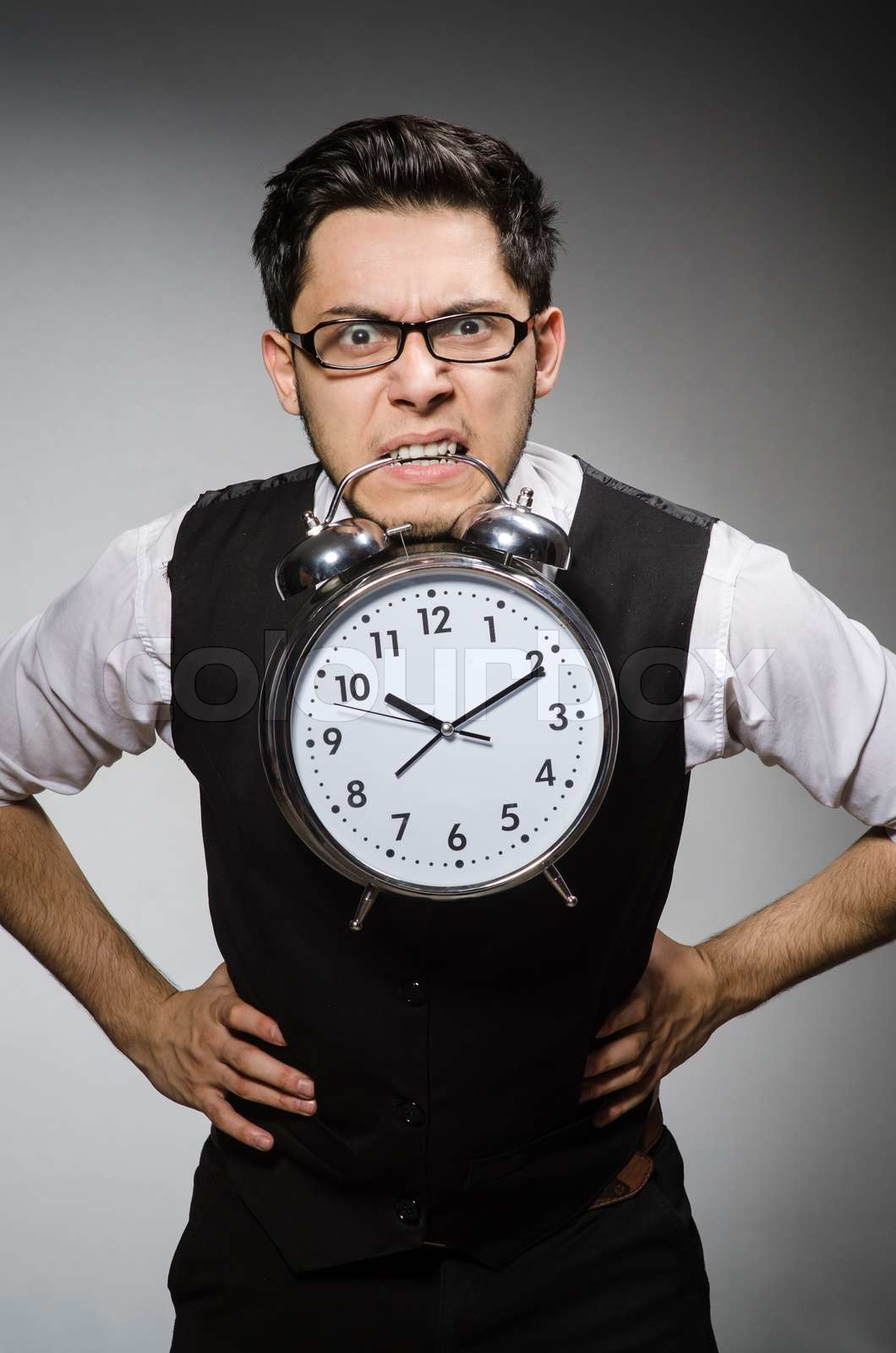 Businessman with clock in time concept | Stock image | Colourbox