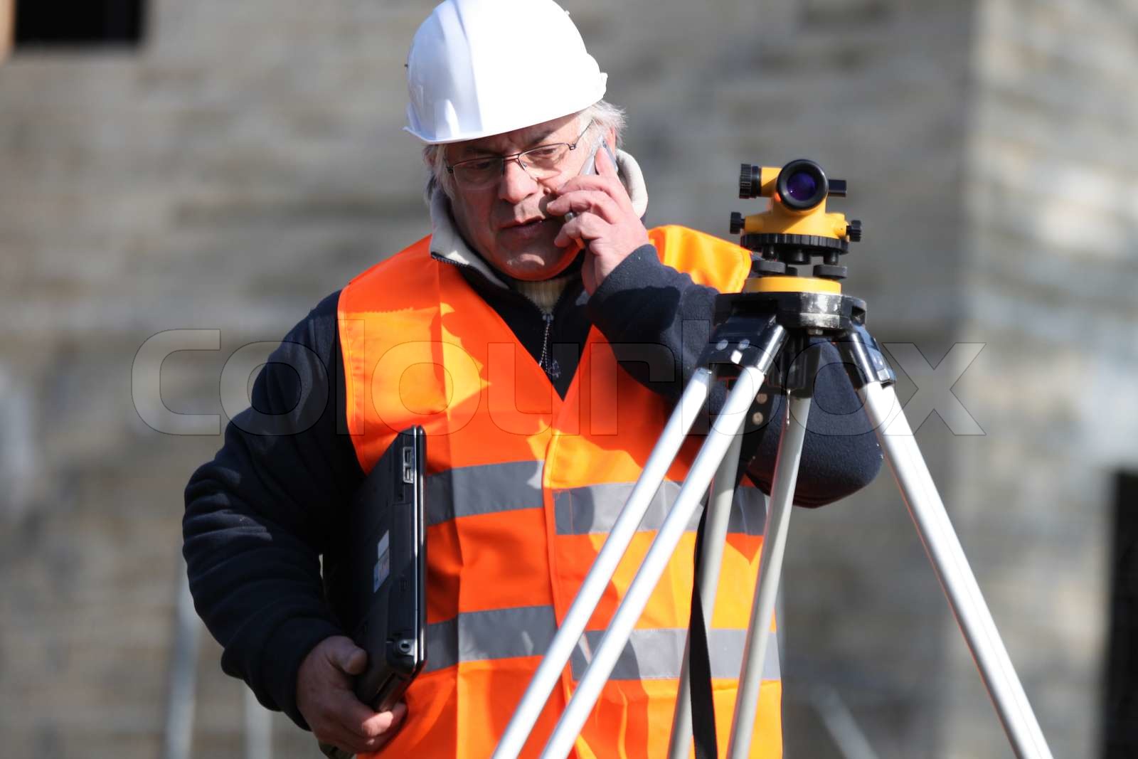 Man surveying site | Stock image | Colourbox