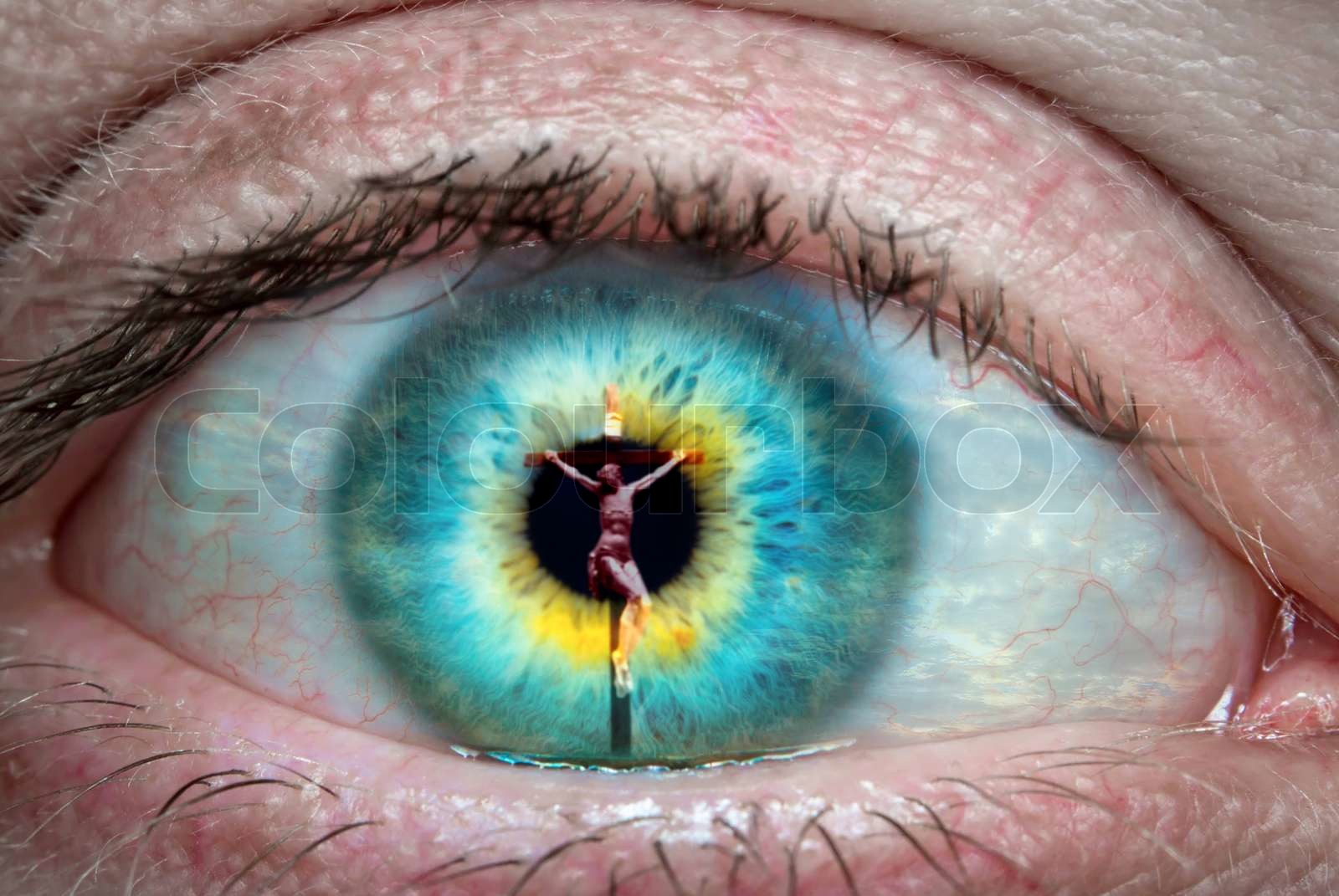 Jesus Christ on the cross reflected in the eye | Stock image | Colourbox
