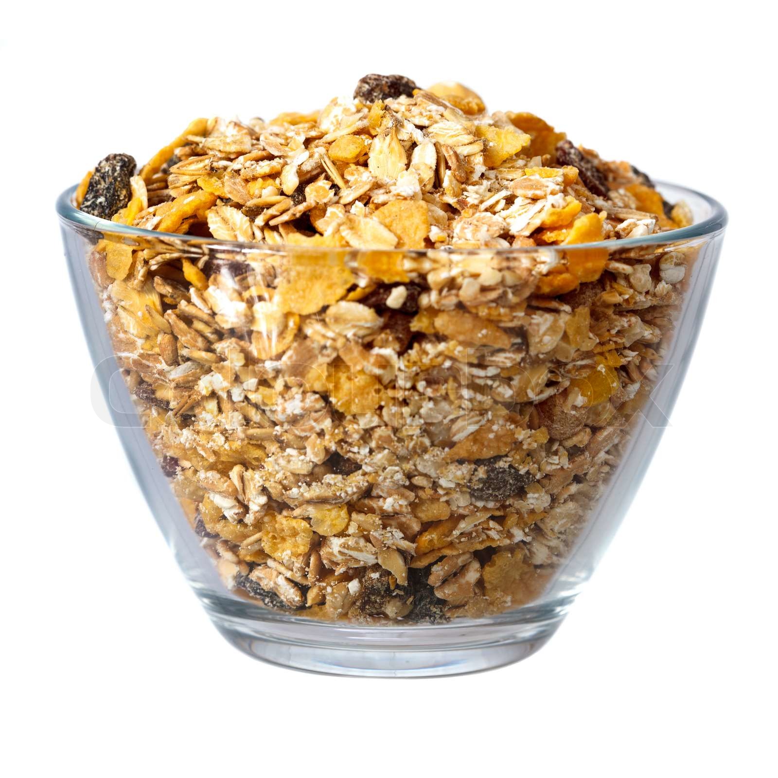 Muesli in glass bowl over white | Stock image | Colourbox