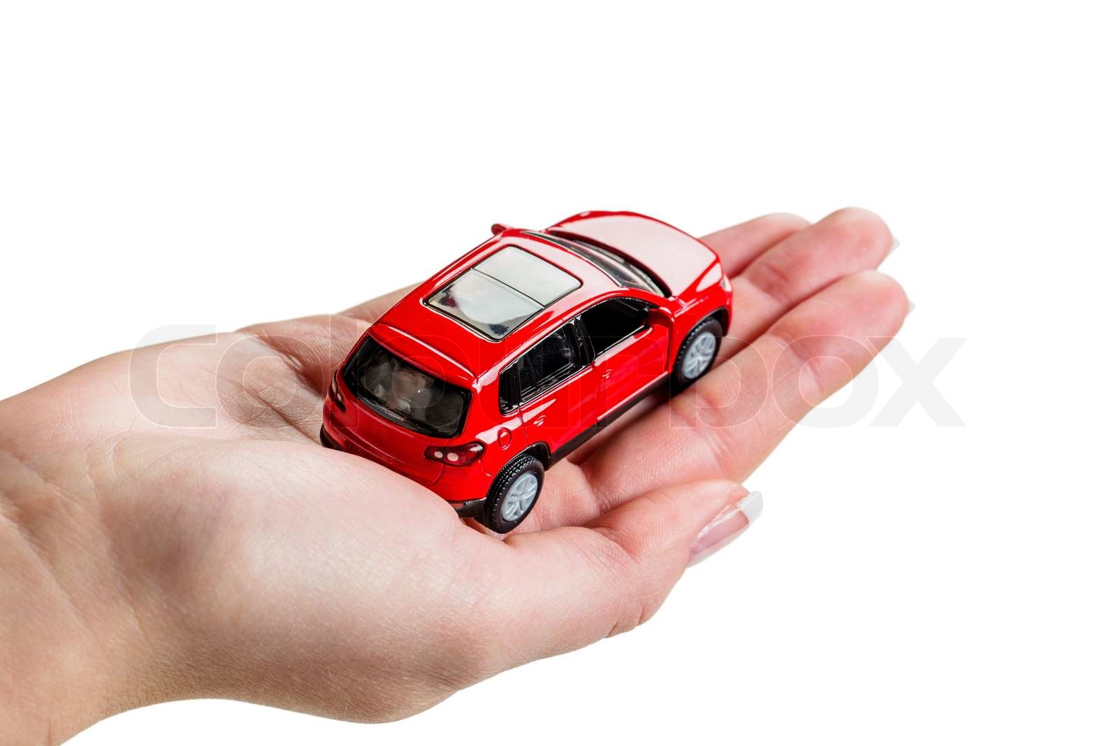 hand holding model of a car | Stock image | Colourbox