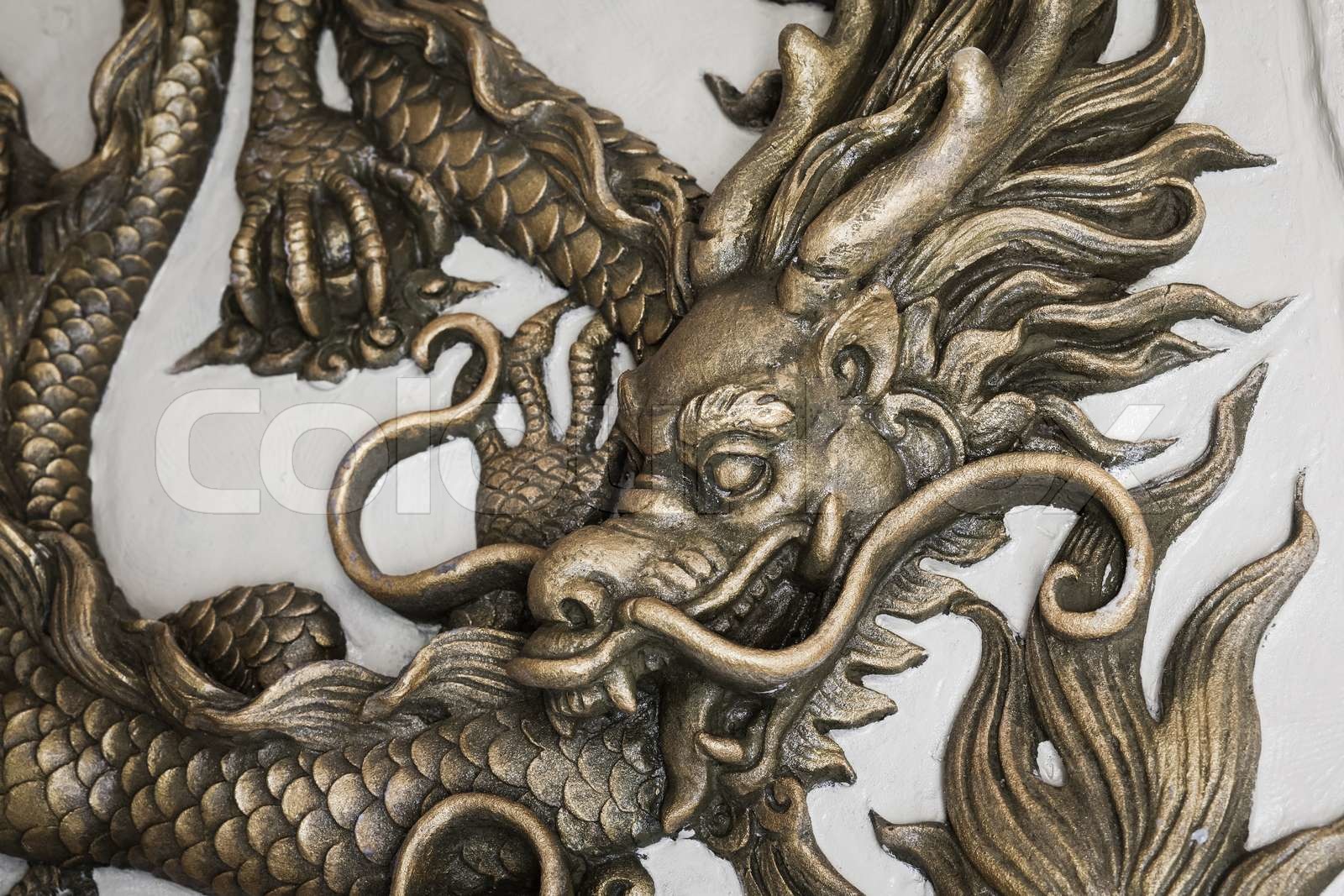 Dragon sculpture on wall | Stock image | Colourbox