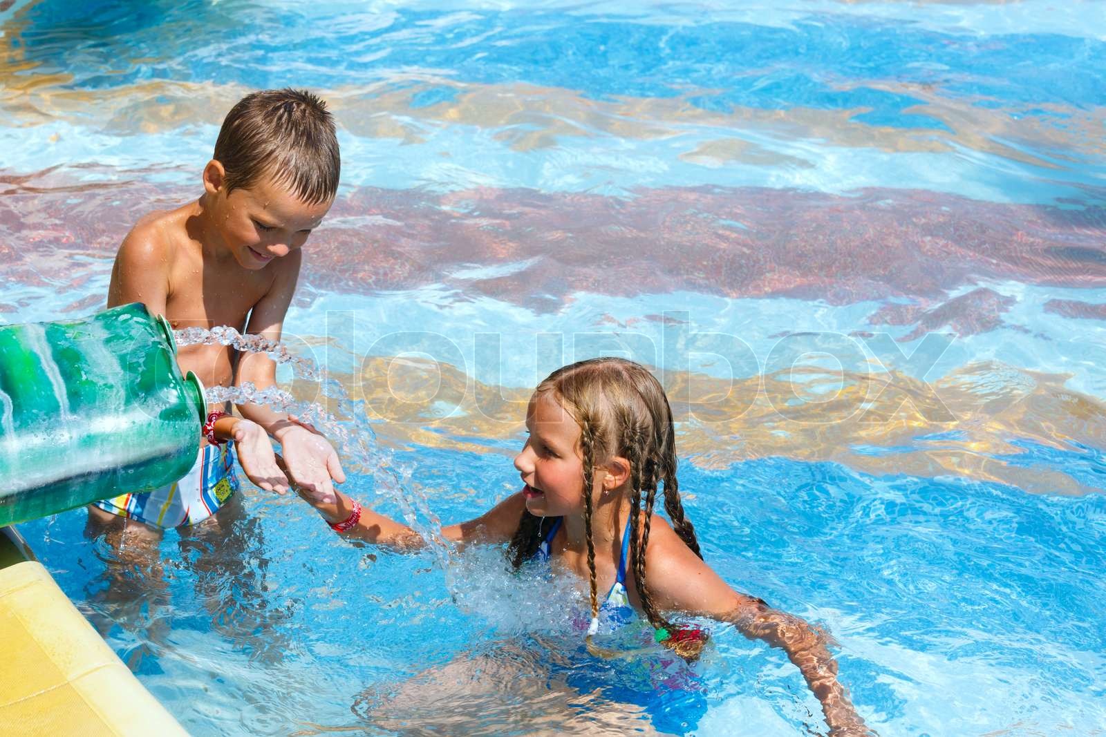 Children in summer outdoor pool. | Stock image | Colourbox