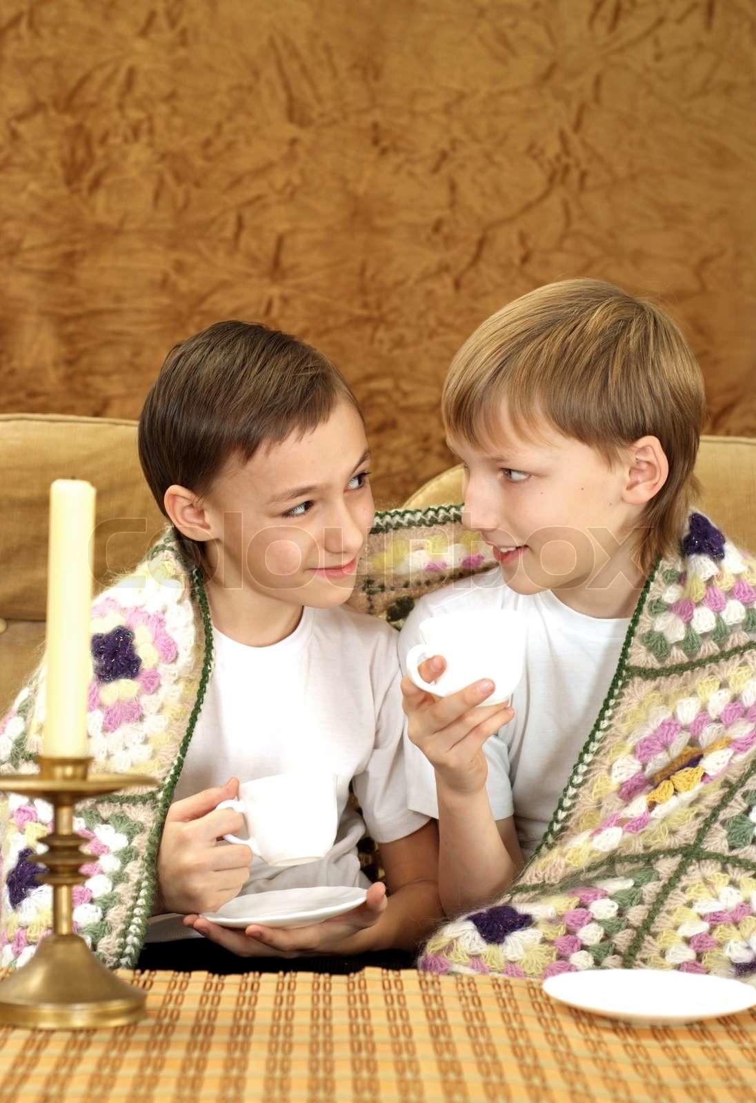 Brothers drink tea at home | Stock image | Colourbox