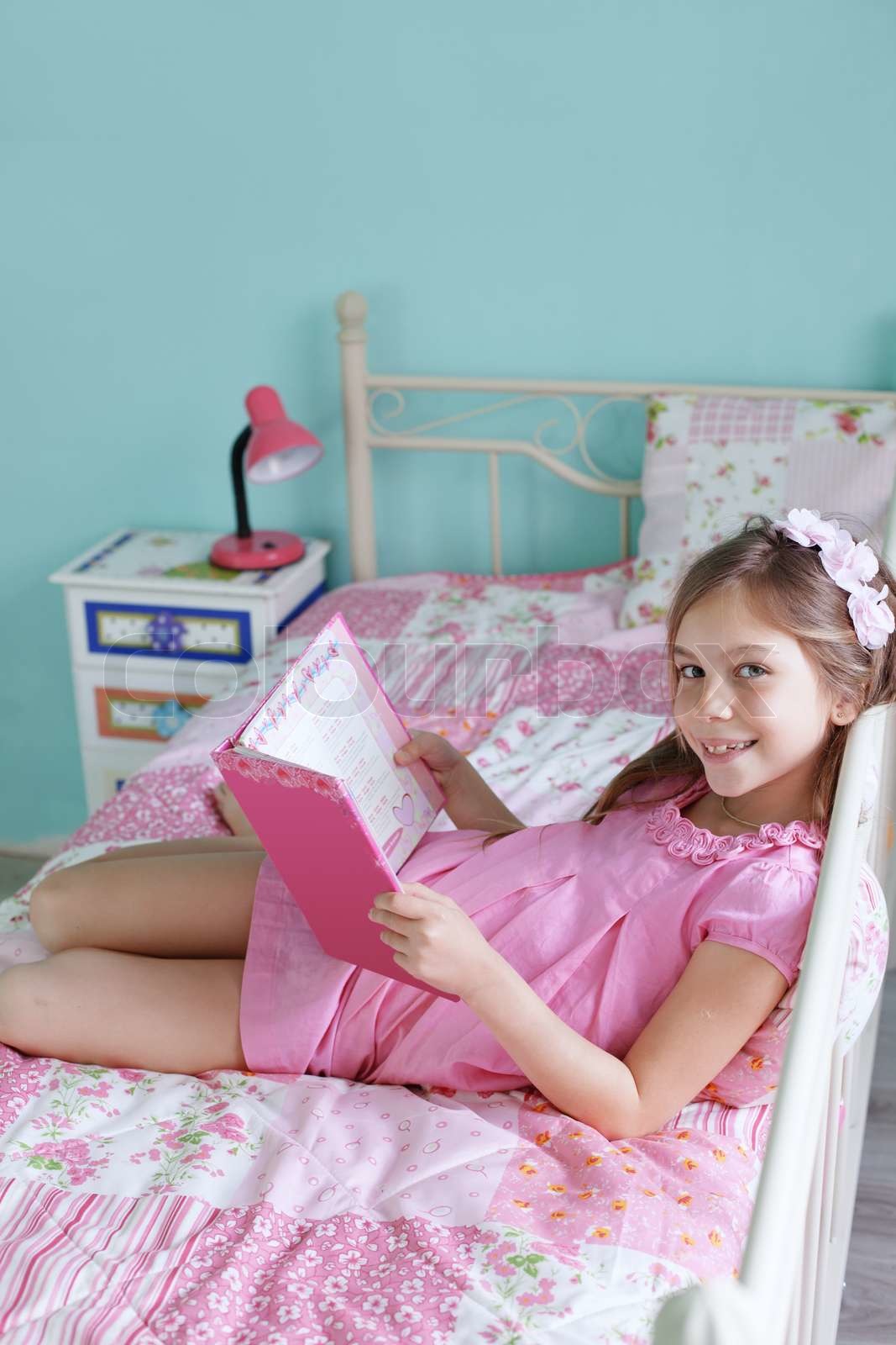School girl reading | Stock image | Colourbox