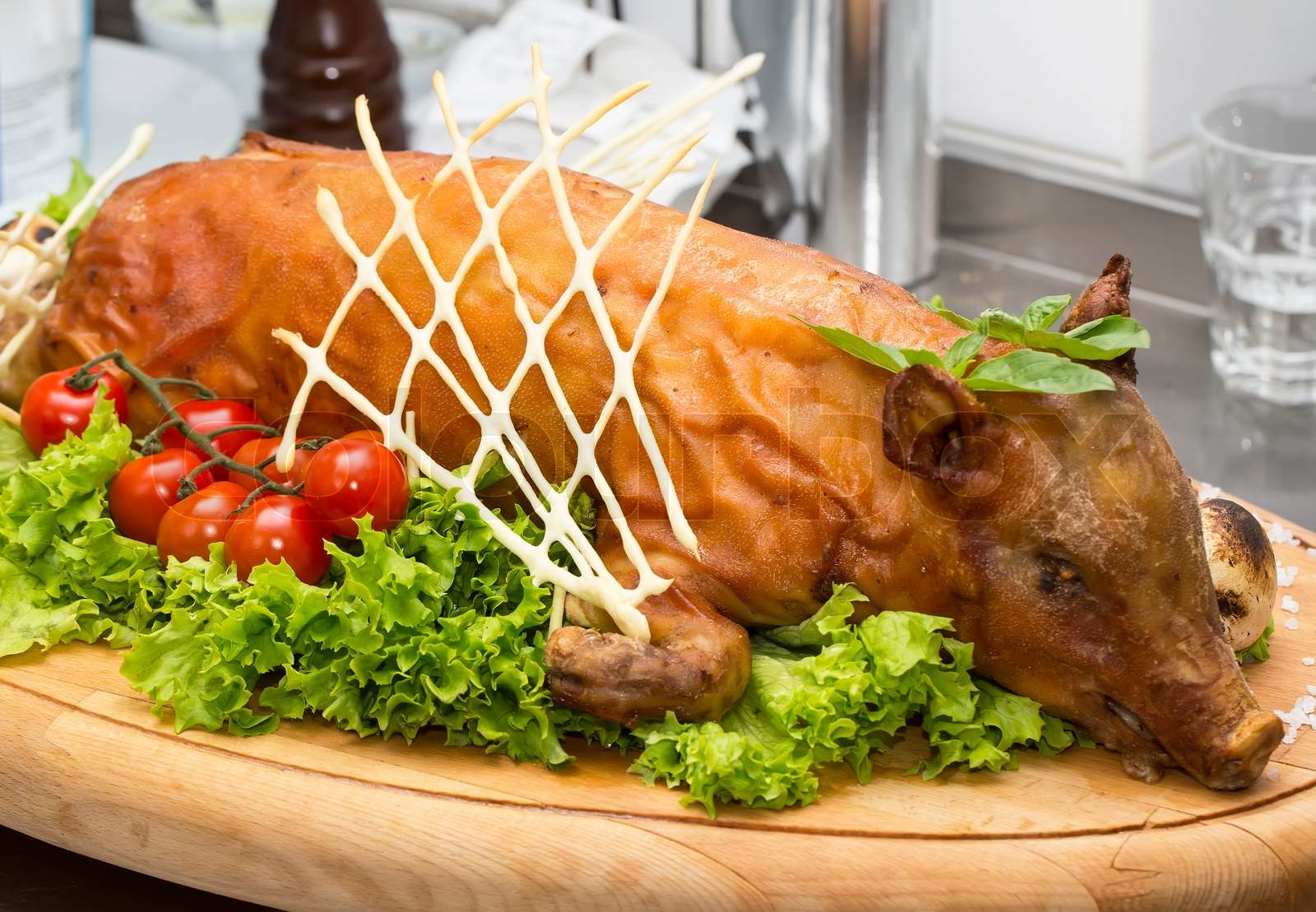 "roasted pig with herbs and vegetables" | Stock image | Colourbox