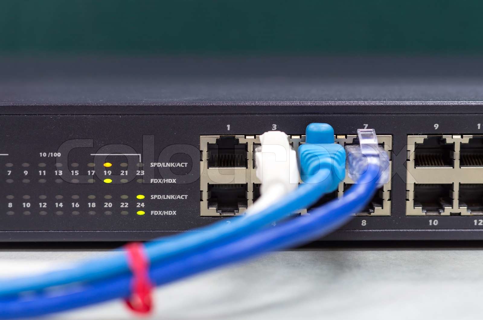 part of Network switch with LAN cable on the office table, Front view ...