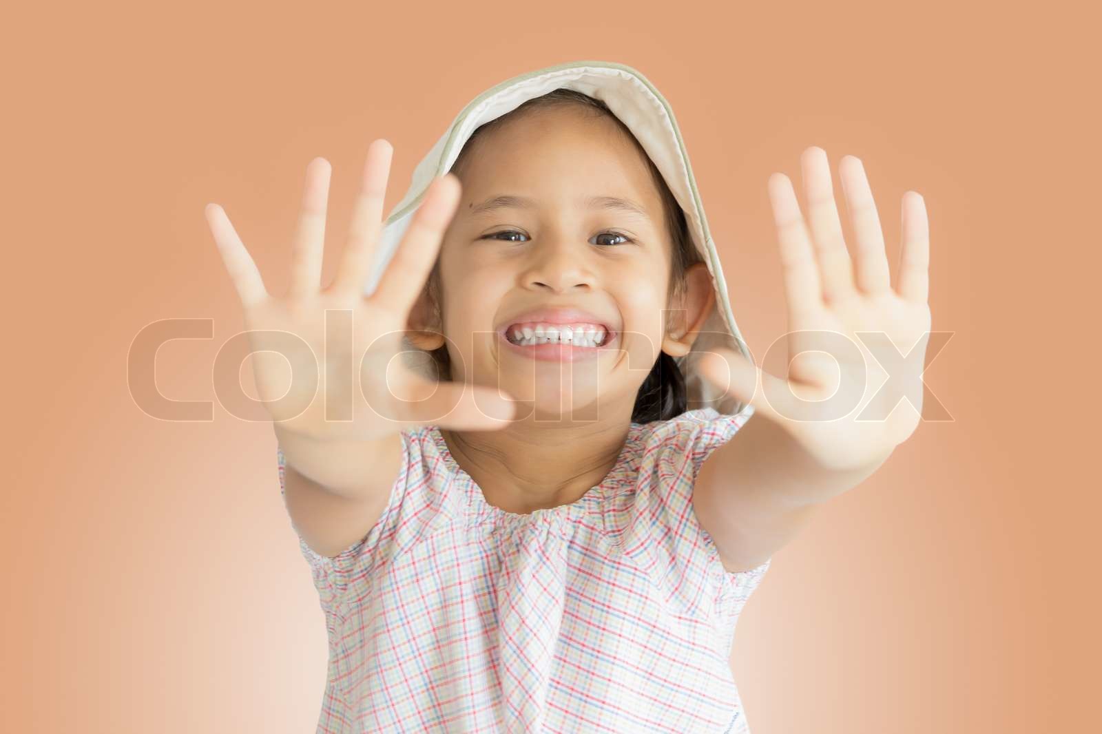 little cute girl showing hers palms | Stock image | Colourbox