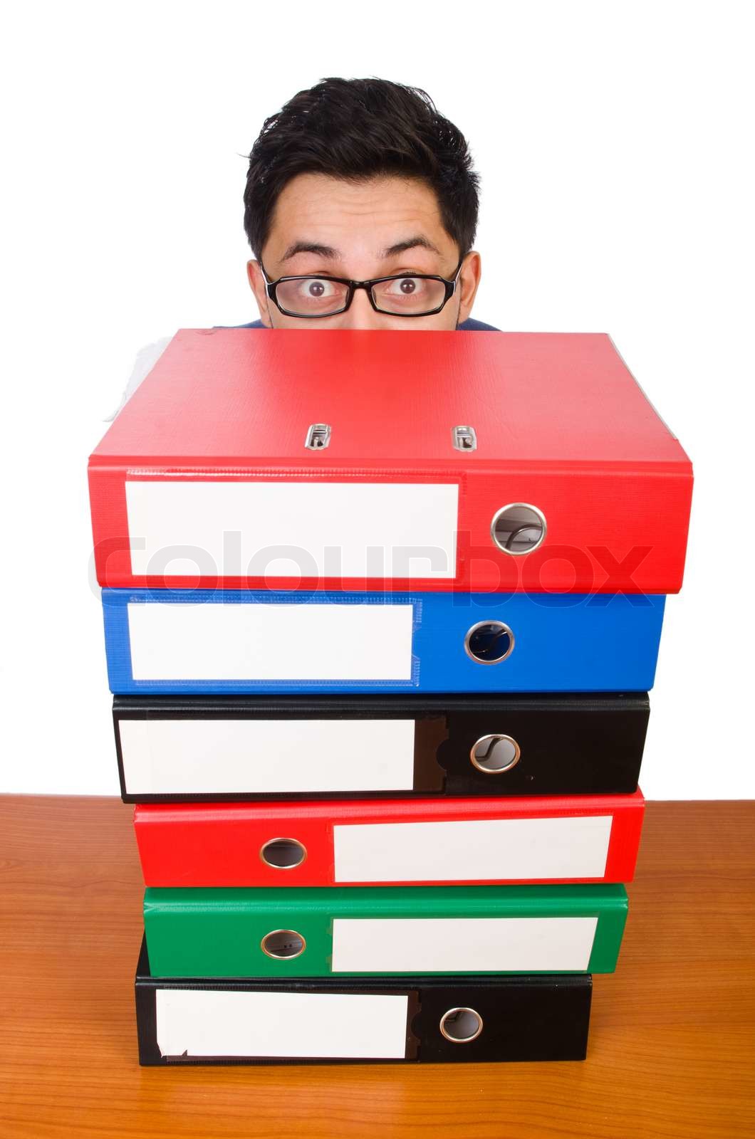 Funny man with lots of folders on white | Stock image | Colourbox